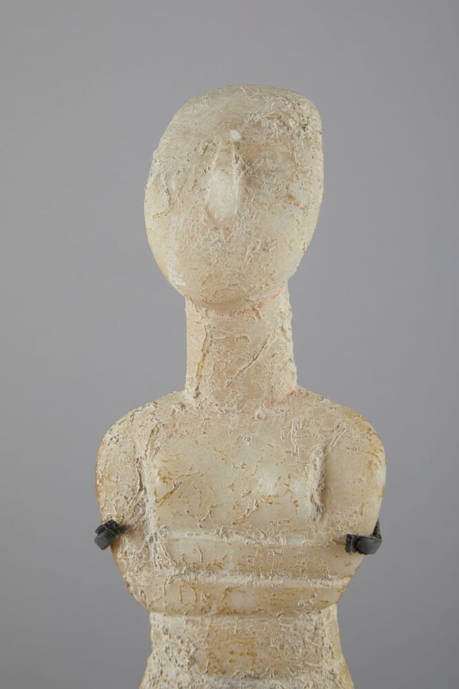340 - Small marble female figurine with folded arms - Sainsbury Centre