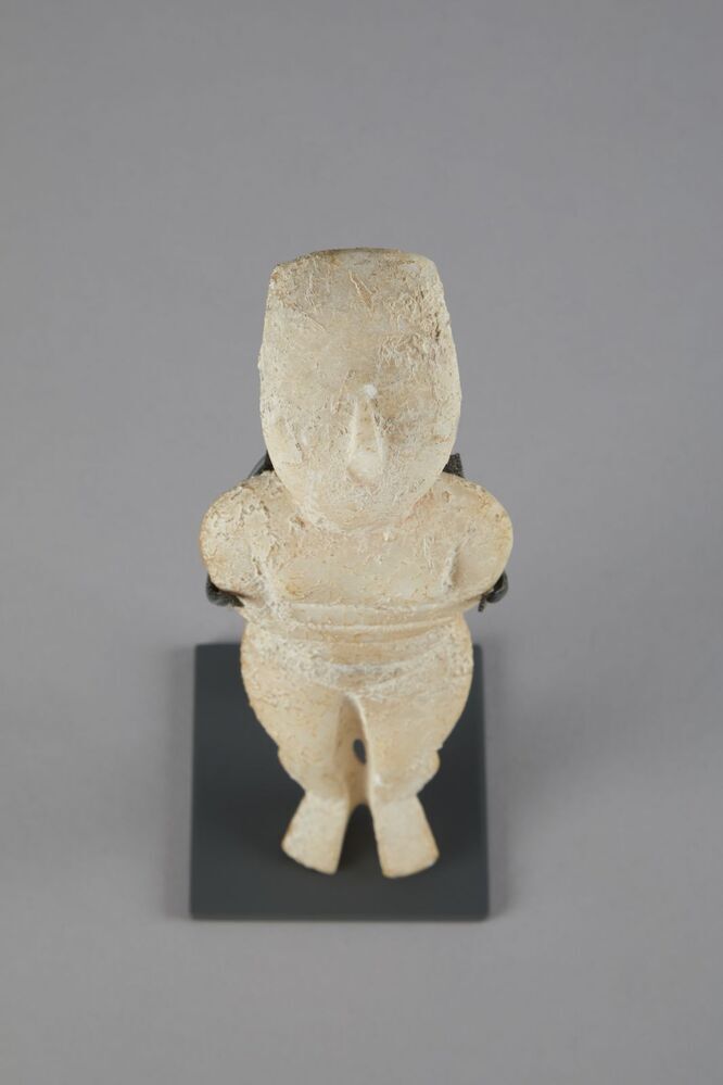 340 - Small marble female figurine with folded arms - Sainsbury Centre